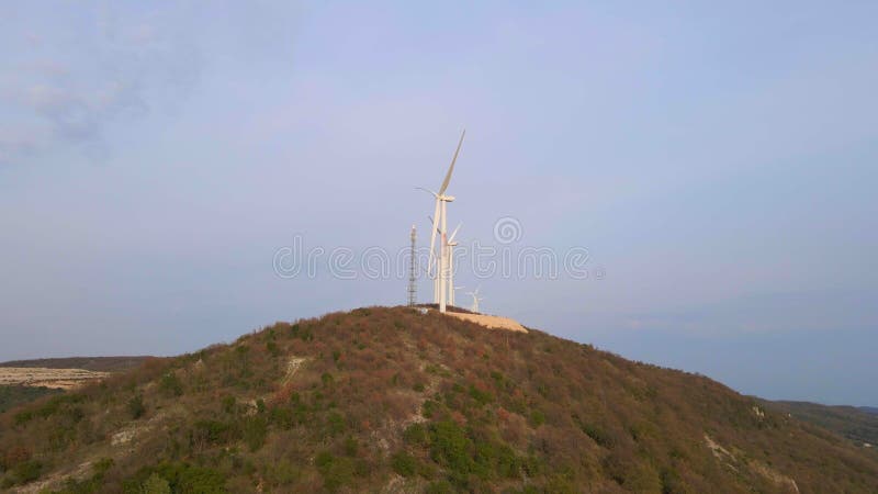 Aerial Video of a Group of Wind Turbines Standing on Hills Stock ...