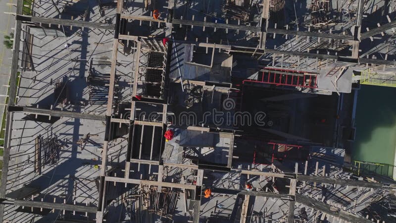 Aerial Video: Aerial Perspective of Workers Pouring Concrete and Cranes ...
