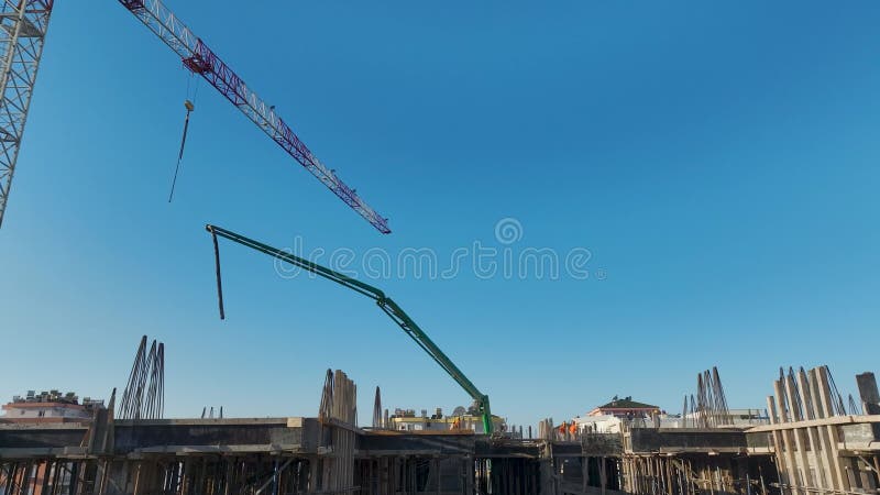 Aerial Video: Skilled Workers and Cranes Pouring Concrete on the Upper ...
