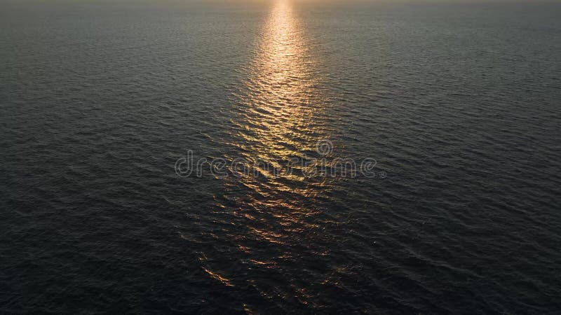 Aerial Video Textured Ocean Surface Reflecting Sunset Rays for a ...