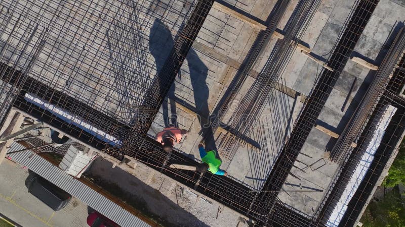 Aerial Video: Aerial View of Construction Activity with Metal Framework ...