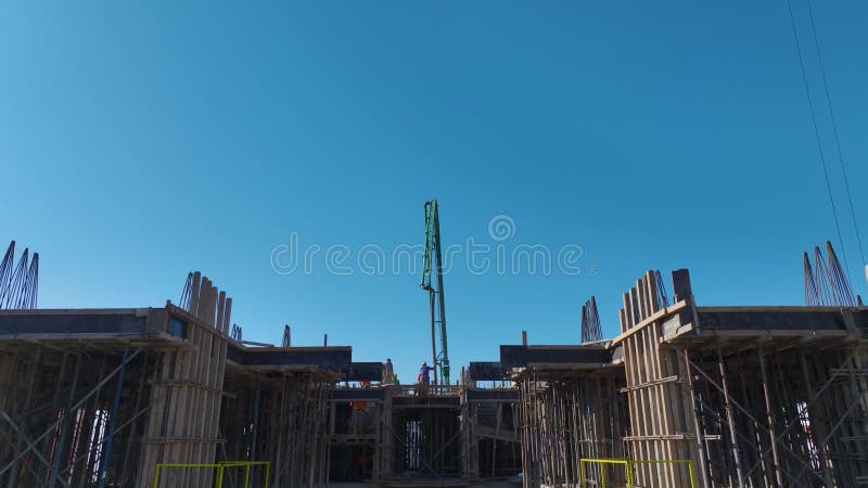 Aerial Video: Workers Completing Concrete and Metal Work on a High-Rise ...