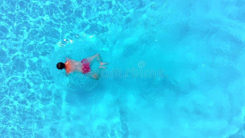 Aerial View As a Man Dives into the Pool and Swims. Stock Video - Video ...