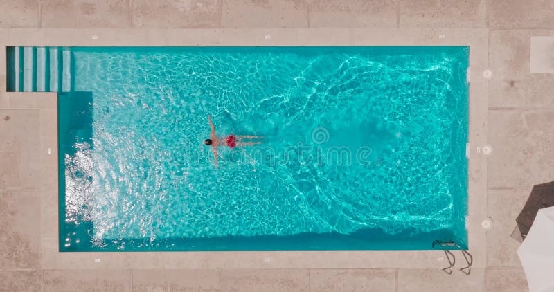 Aerial View As a Man Dives into the Pool and Swims Stock Video - Video ...