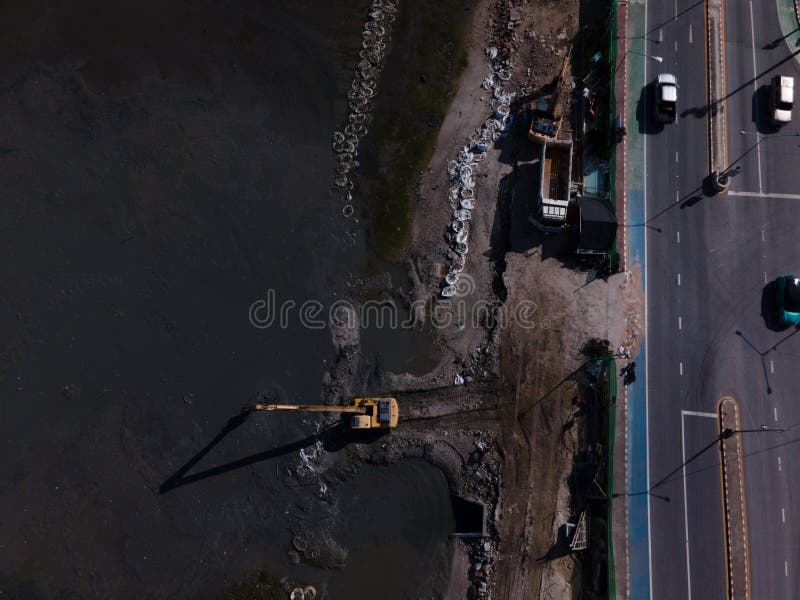 Aerial View of Backhoe Working on the Mud for Solve Pollution Problems ...