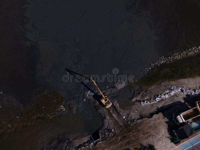 Aerial View of Backhoe Working on the Mud for Solve Pollution Problems ...