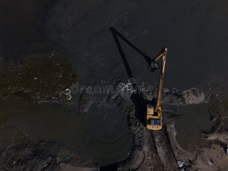 Aerial View of Backhoe Working on the Mud for Solve Pollution Problems ...