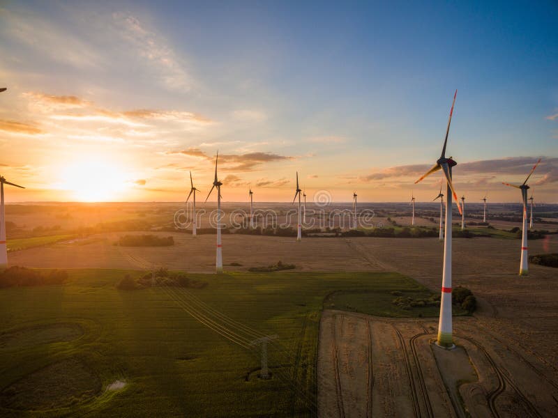 Aerial View of a Beautiful Sunset Above the Windmills / Wind Turbines ...