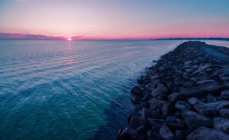 Aerial View of Beautiful Sunset Over Water and Breakwater. Stock Photo ...