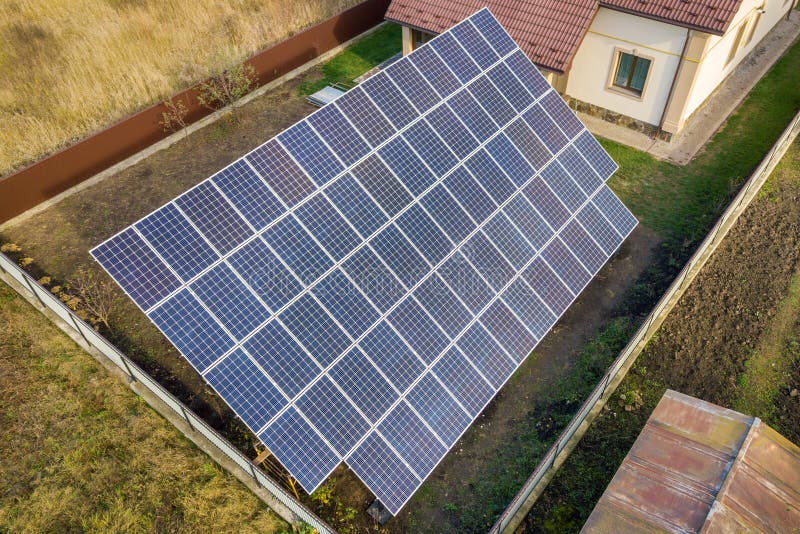 Aerial View of Big Blue Solar Panel Installed on Ground Structure Near ...