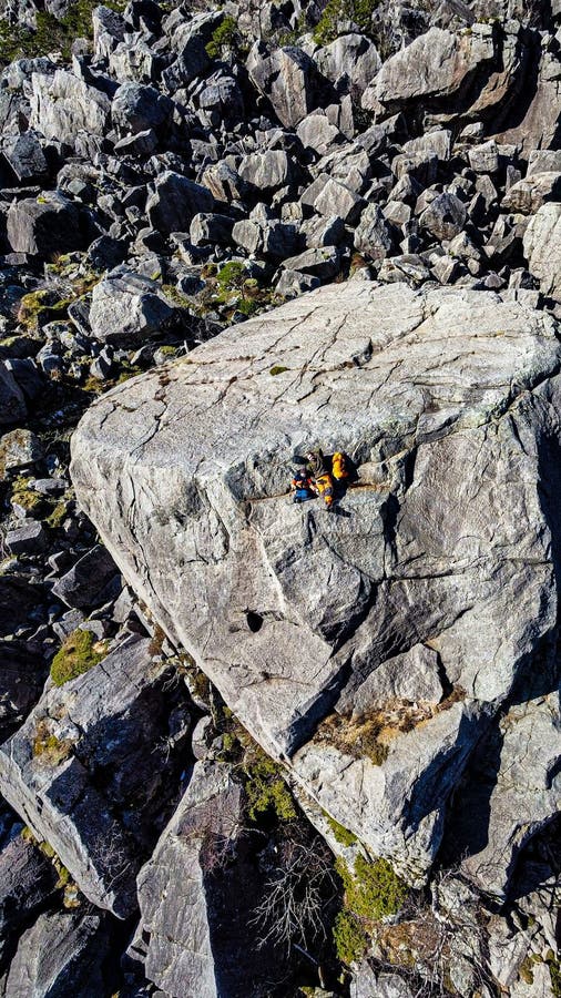 Aerial View of Boys Chilling on Big Rock Formations in Norway Stock ...