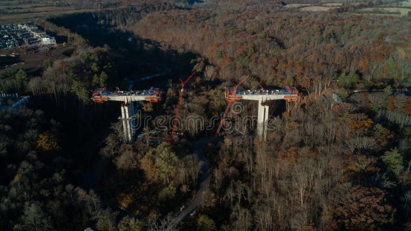 An Aerial View of a Bridge Being Built Over a Valley Stock Image ...