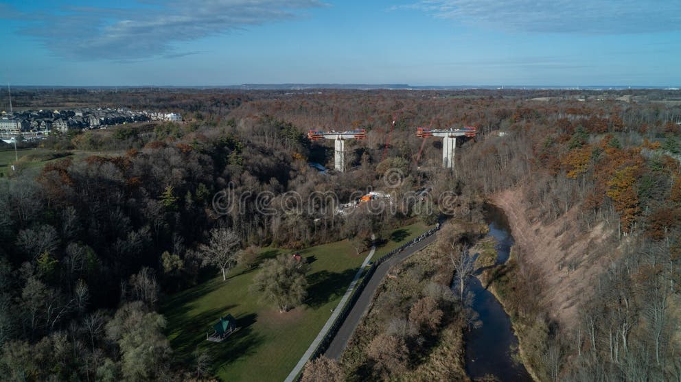 An Aerial View of a Bridge Being Built Over a Valley Stock Photo ...