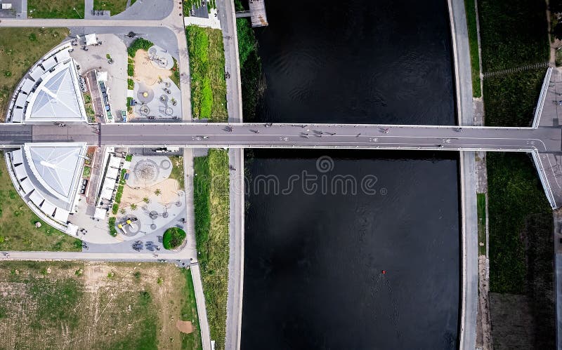 Aerial View of a Bridge Crossing Over a River and a Complex Building ...
