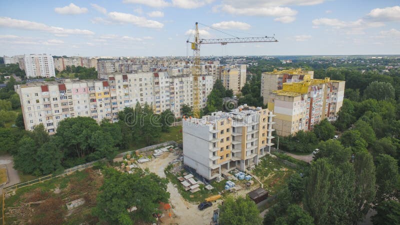Aerial Building Process of Construction Site. Engineers Crane and City ...