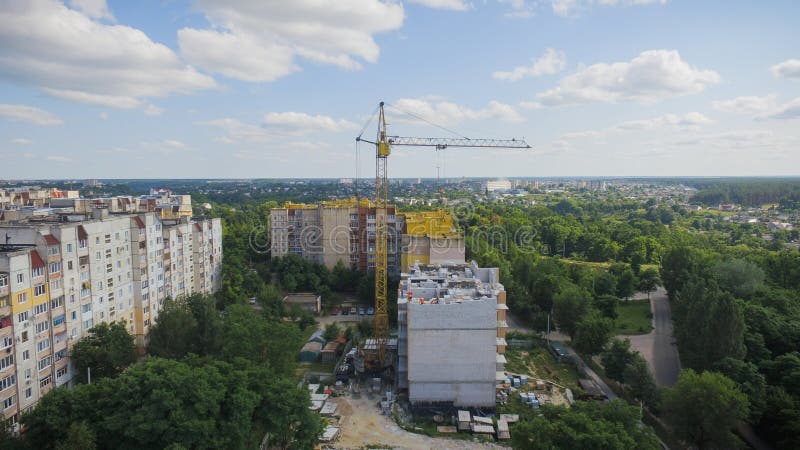 Aerial Building Process of Construction Site. Engineers Crane and City ...