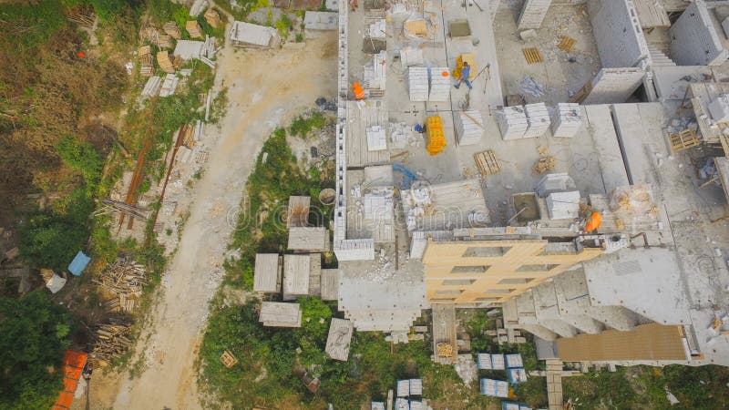 Aerial Building Process of Construction Site. Engineers Crane and City ...