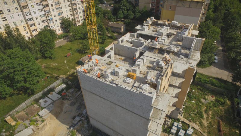 Aerial Building Process of Construction Site. Engineers Crane and City ...
