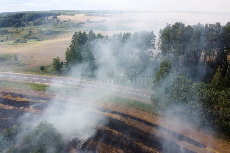 Aerial View of Burning Field with Smoke and Road Stock Photo - Image of ...