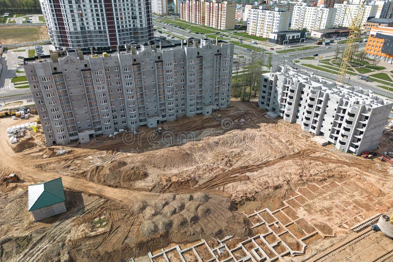 An Aerial View of a Bustling Construction Site in a City, Where Workers ...