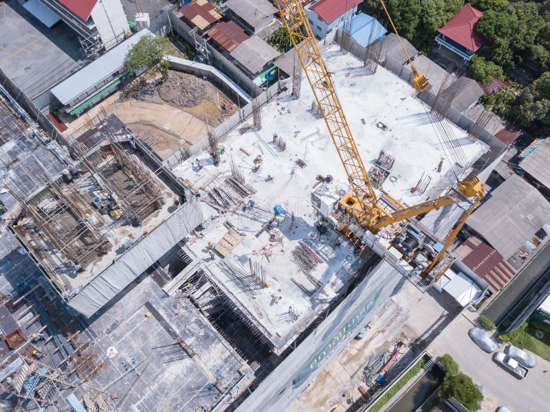 Aerial View of Busy Industrial Construction Site Workers with Cranes ...