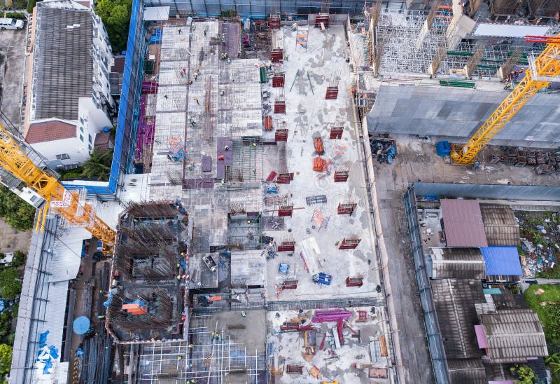 Aerial View of Busy Industrial Construction Site Workers with Cranes ...