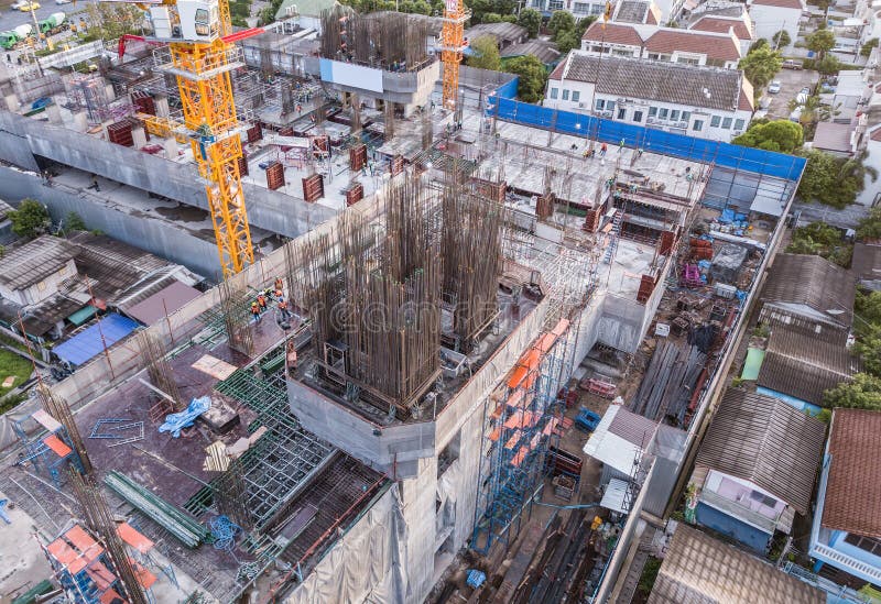 Aerial View of Busy Industrial Construction Site Workers with Cranes ...