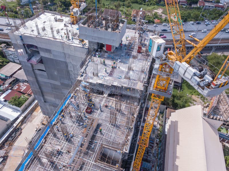 Aerial View of Busy Industrial Construction Site Workers with Cranes ...