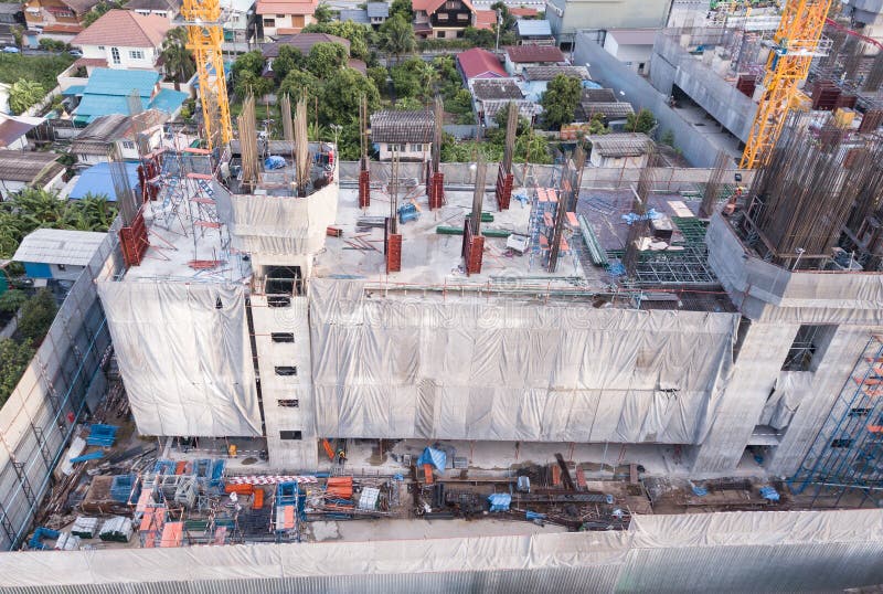 Aerial View of Busy Industrial Construction Site Workers with Cranes ...