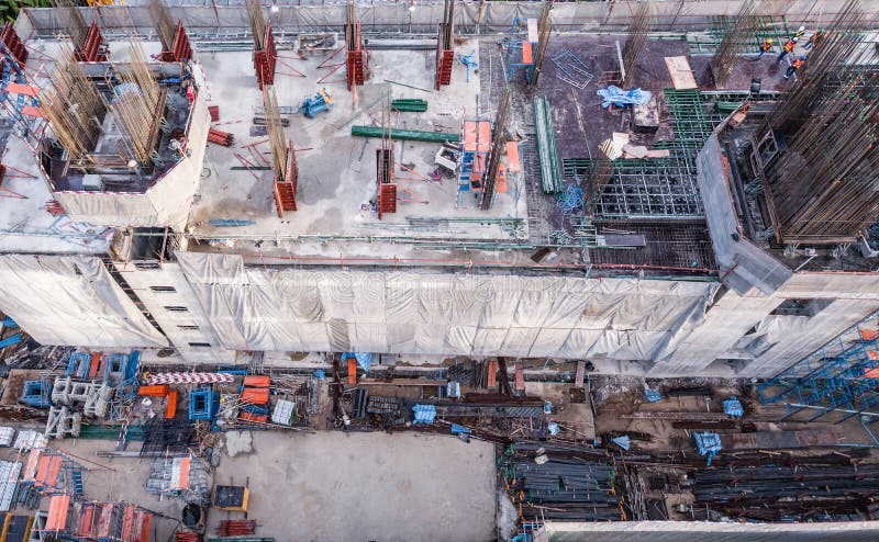 Aerial View of Busy Industrial Construction Site Workers with Cranes ...