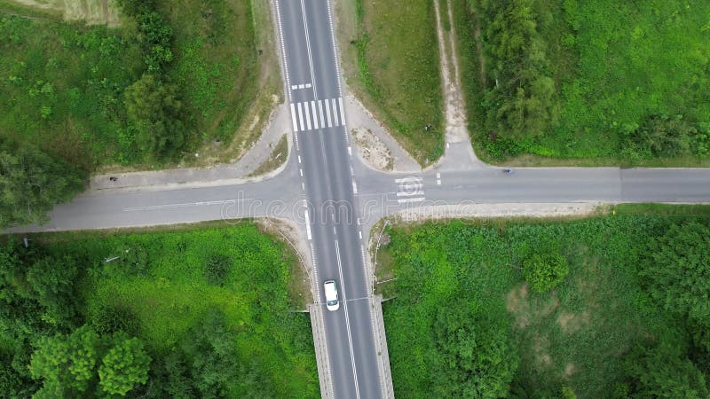 Aerial View of Busy Intersection with Multiple Vehicles in Green ...