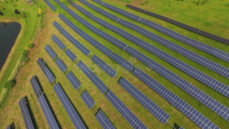 Aerial View Captures Parallel Rows of Solar Panels Stretching Across a ...