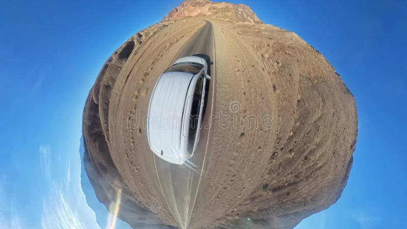 Aerial View of a Car Driving on a Winding Desert Road, with a Creative ...