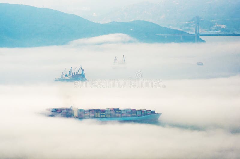Cargo ship in sea fog stock photo. Image of transport - 302944618
