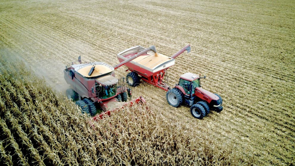Aerial View of a Case IH Combine Unloading Field Corn into a Wagon ...