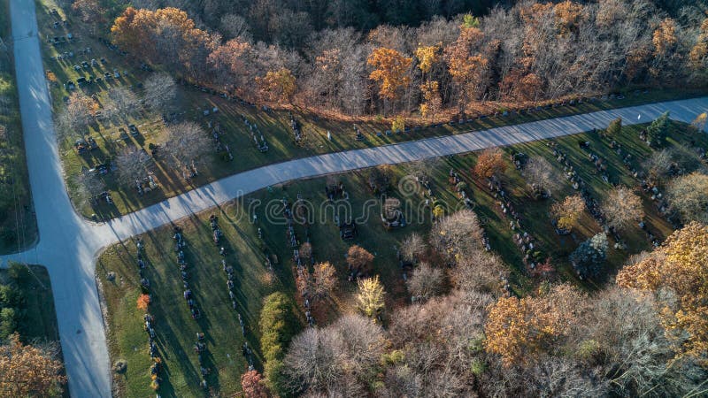An Aerial View of a Cemetery beside a Forest in Autumn Stock Photo ...