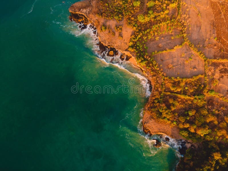 Aerial View of Coastline with Waves and Warm Sunset Stock Photo - Image ...
