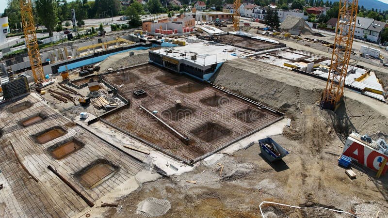 Aerial View of a Construction Site with Cranes and Building Foundations in Progress Stock Photo ...