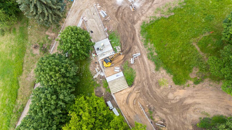 Aerial View of Construction Site with Excavator and Trees Stock Image ...