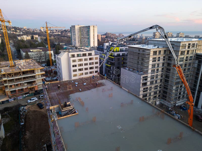 Aerial View of a Construction Site with a High-rise Building Under ...
