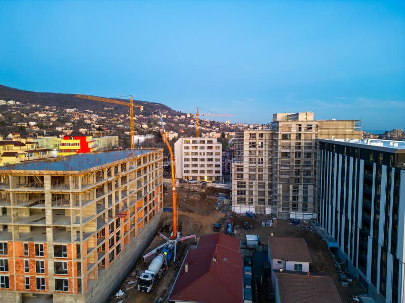 Aerial View of a Construction Site with a High-rise Building Under ...