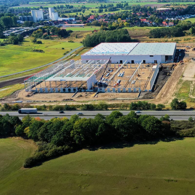 Aerial View of a Construction Site with the Shell of a Warehouse Next ...
