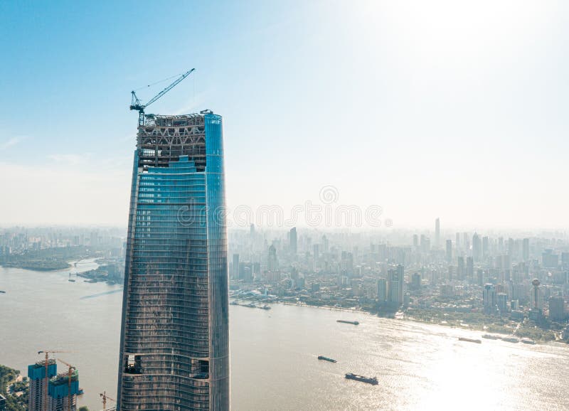 Aerial View of a Construction of a Skyscraper at the Waterfront on a ...