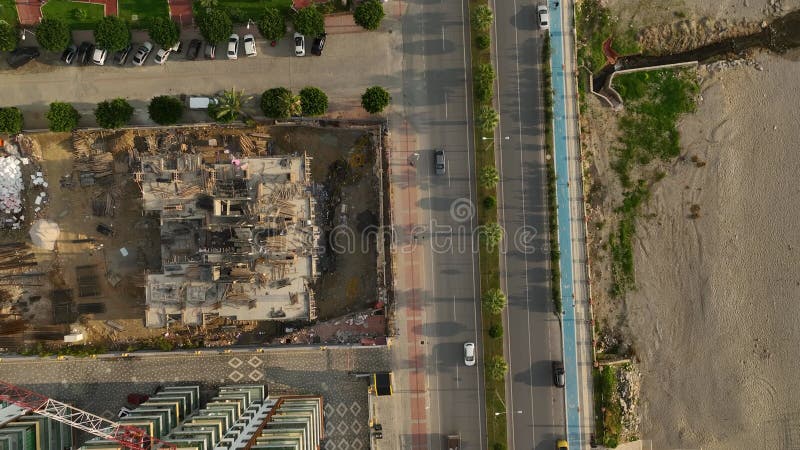 Aerial View: Construction Workers and Heavy Equipment Actively ...