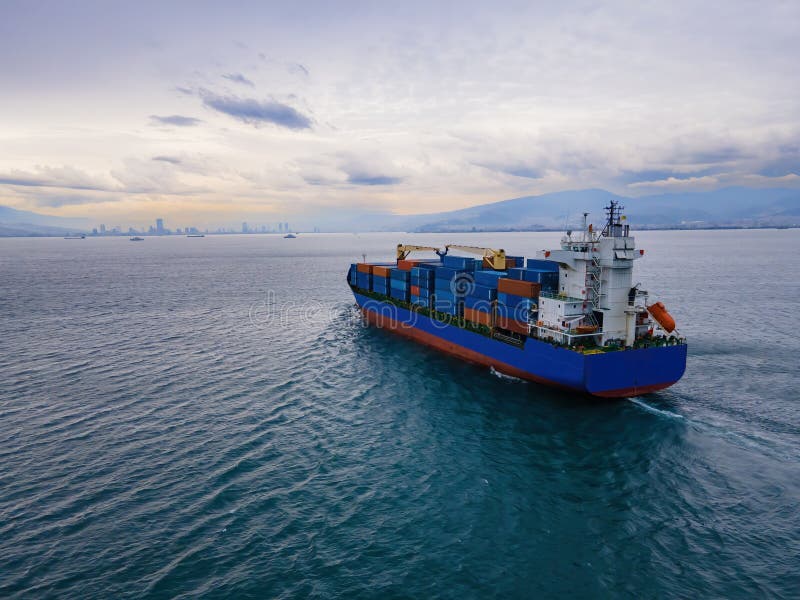 Container Ship Driving on the Sea for Logistic Import Export or ...