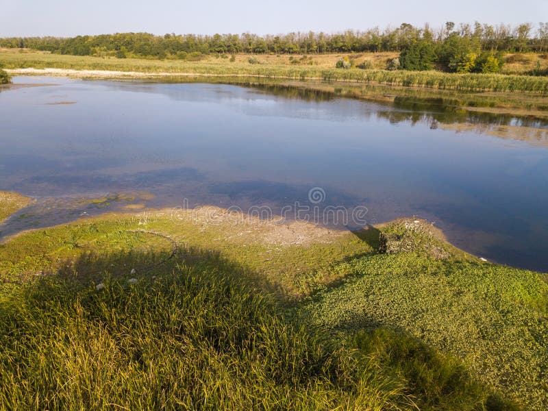 Aerial View of the Countryside and a Circular Lake in the Middle of the ...