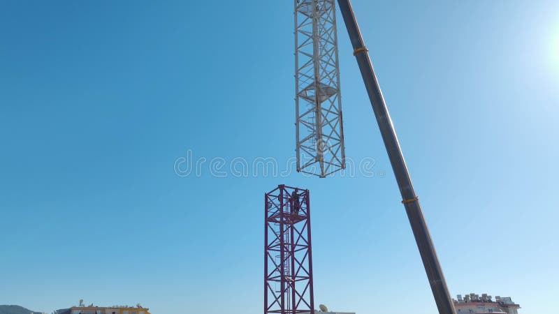 Aerial View: Crane Operator Assembles Components and Climbs High ...