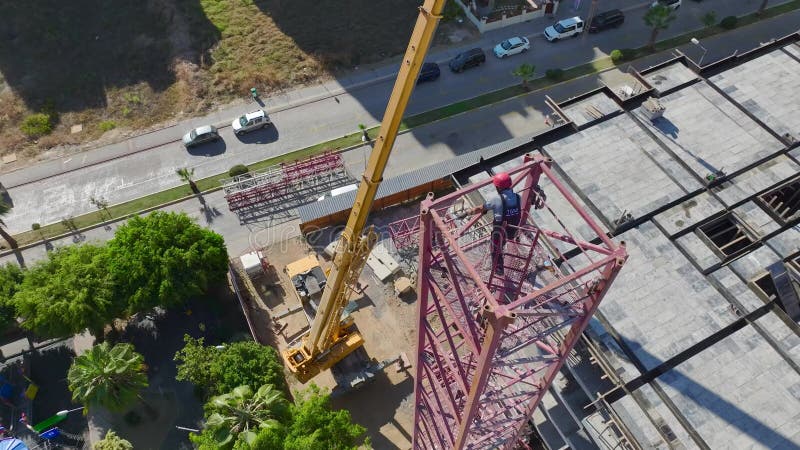 Aerial View: a Crane Operator Assembles Components on-site while ...