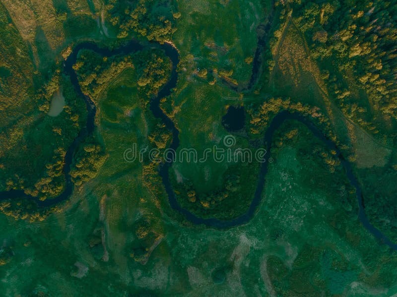 Aerial View of a Curvy River through the Green Forested Valley Stock ...