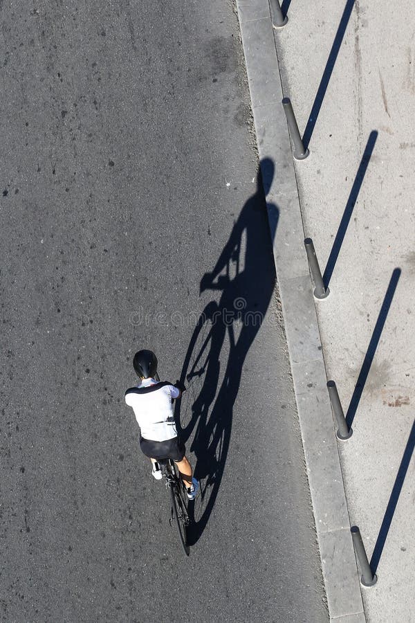 Aerial View of Cyclist on the Road with Shadows Stock Image - Image of ...